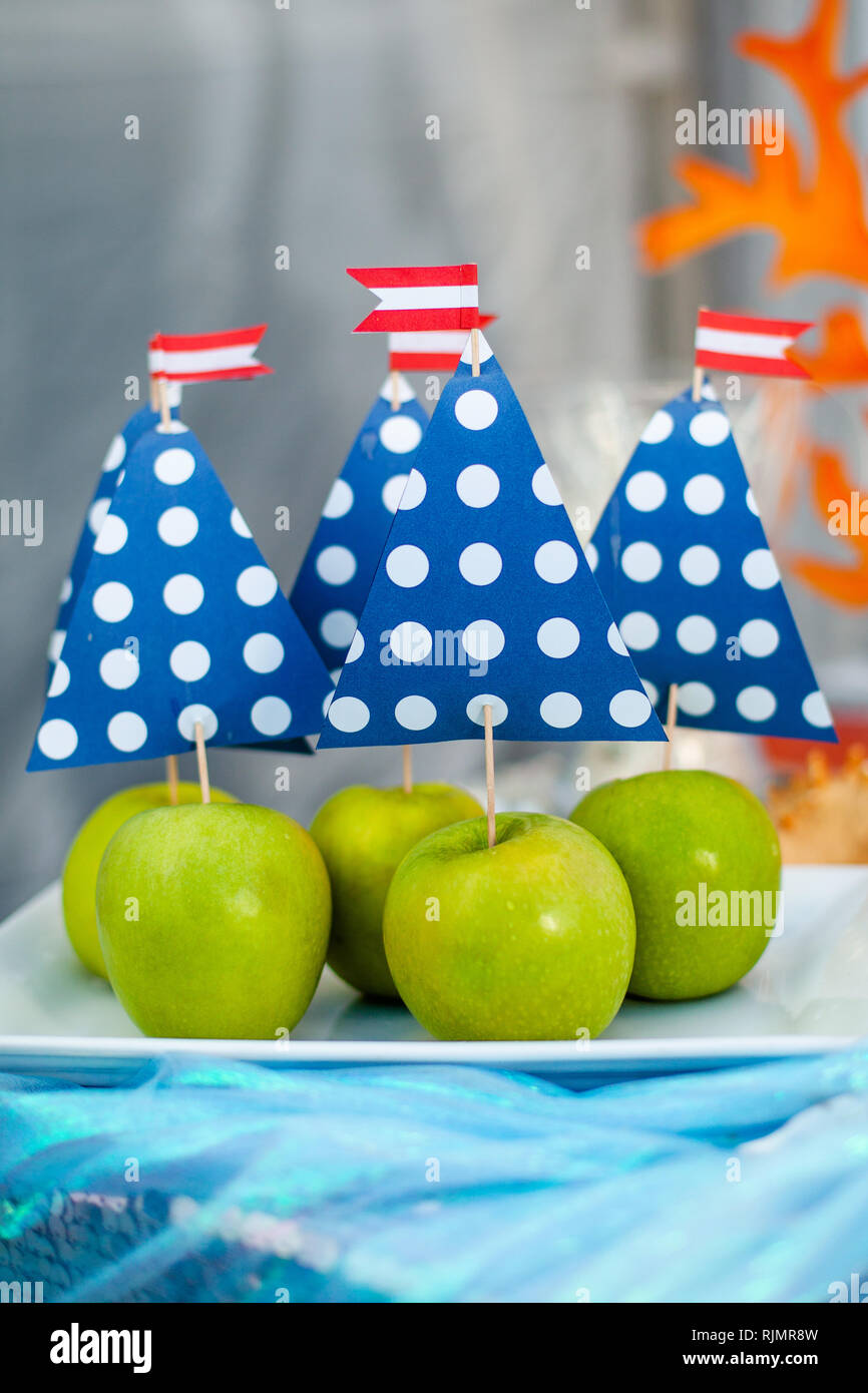Green apples with blue paper sail. Sea time theme on the party's candy ...