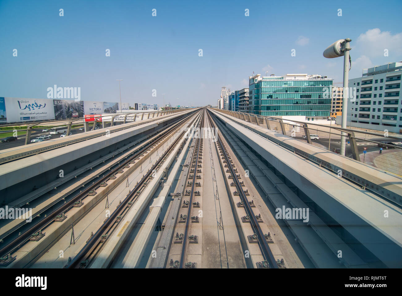 Sheikh Zayed road and metro railway. Sunrise in Dubai Stock Photo - Alamy