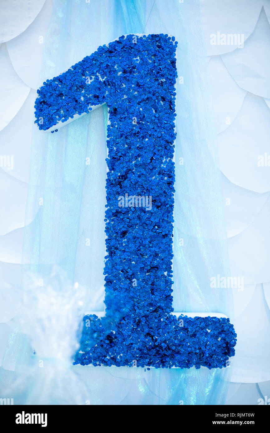 Blue big number one on the wall Stock Photo - Alamy
