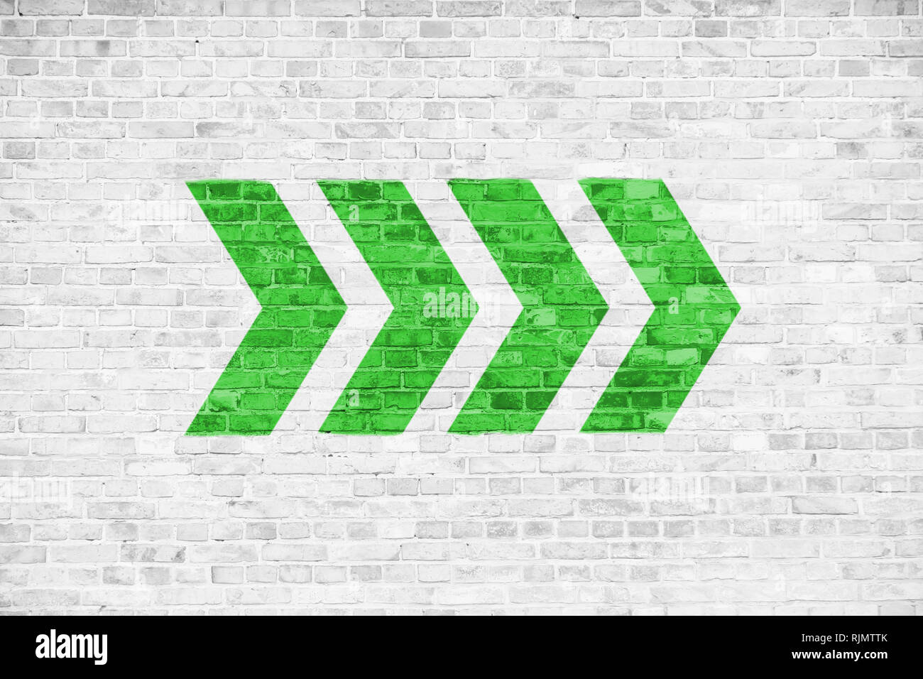 Go ahead green directional arrow signs pointing direction painted on a ...