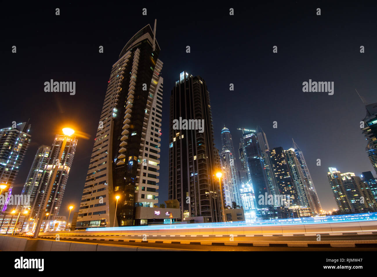 Colorful city lights at night time in Dubai Marina, United Arab ...
