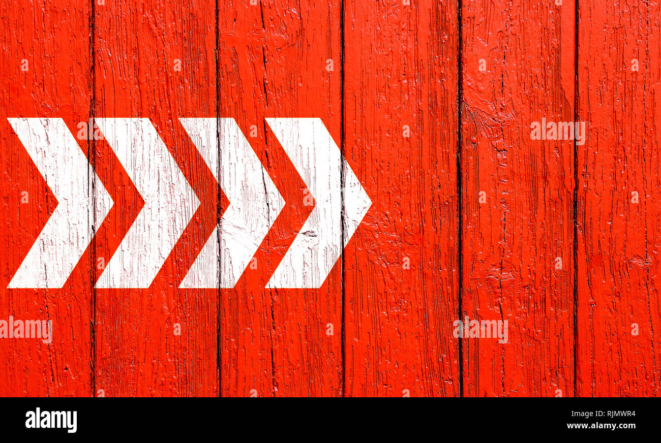 White directional arrow signs pointing direction left to right painted ...