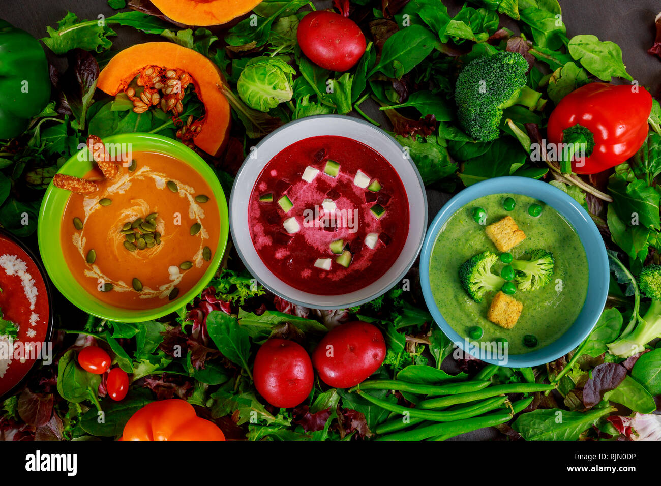 Different set vegetable cream multi colored soups top view Stock Photo ...