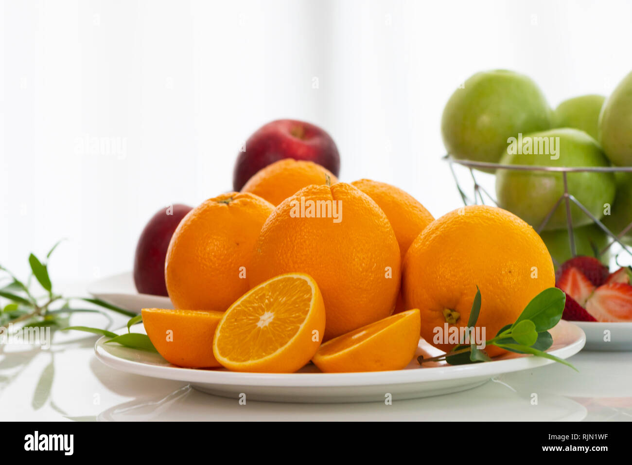 Juicy orange isolated on white background Stock Photo - Alamy