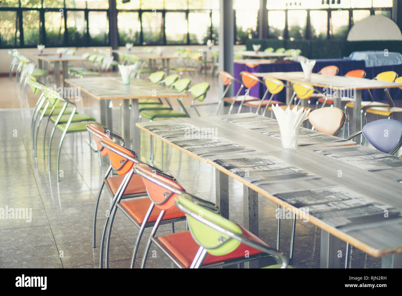 Tables and chairs empty in canteen Stock Photo - Alamy