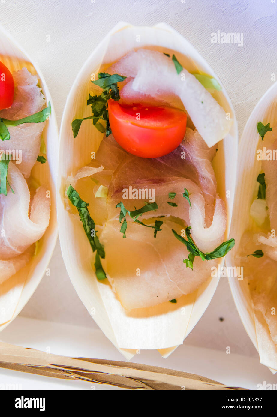 small boats with smoked swordfish, cherry tomatoes and herbs, excellent ...