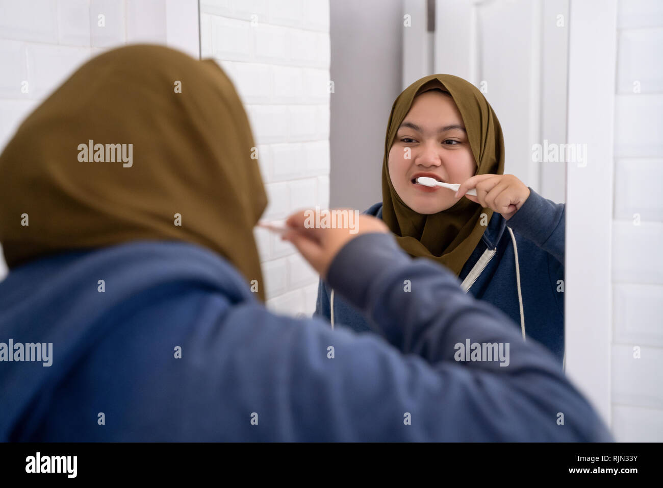 young woman hijab doing routine activities Stock Photo - Alamy