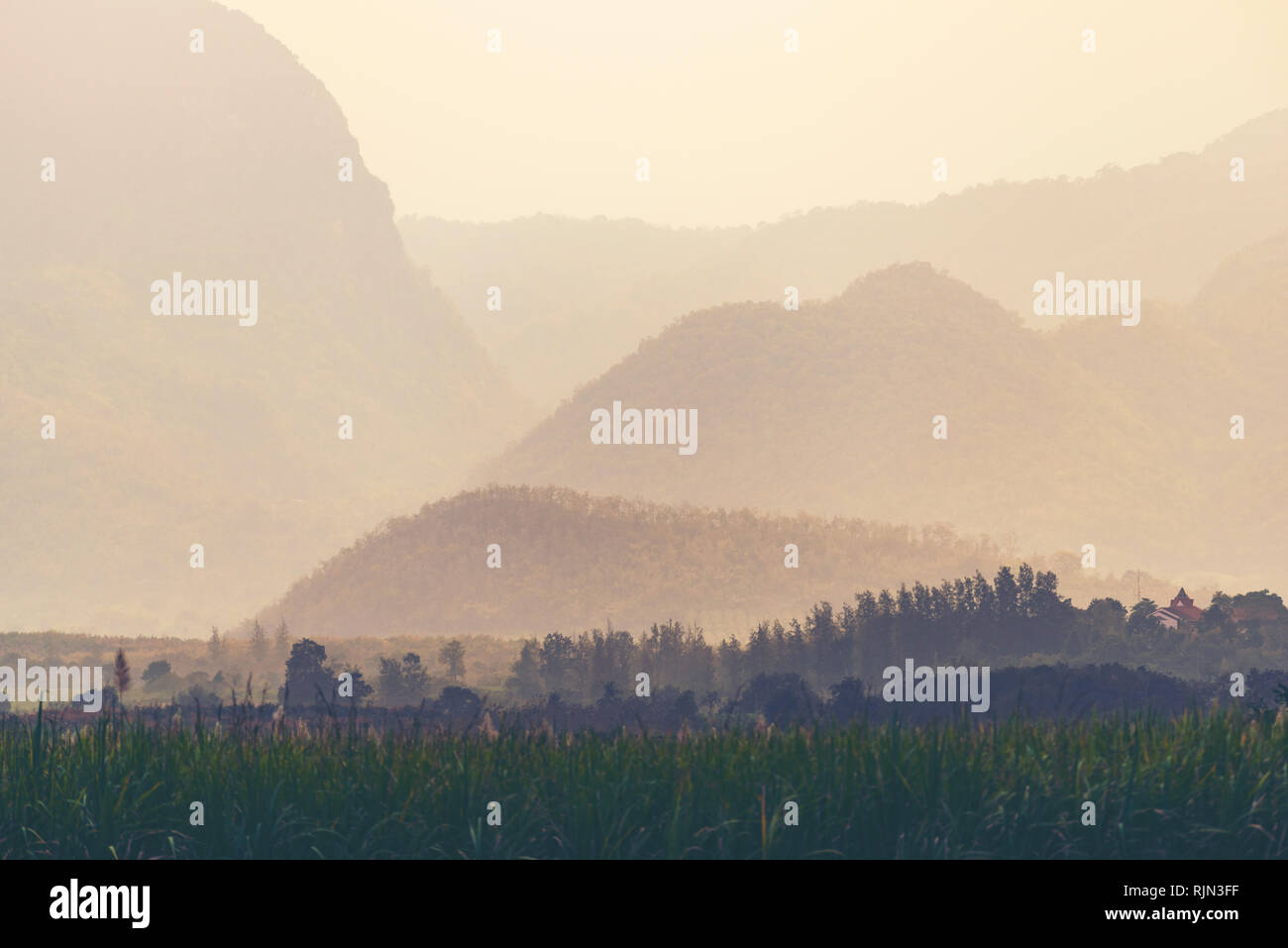 Orange and yellow sunset with mountains silhouettes. Gradient vivid ...