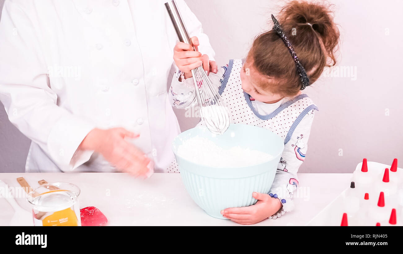 Step by step. Mixing royal icing to decorate sugar cookies Stock Photo ...