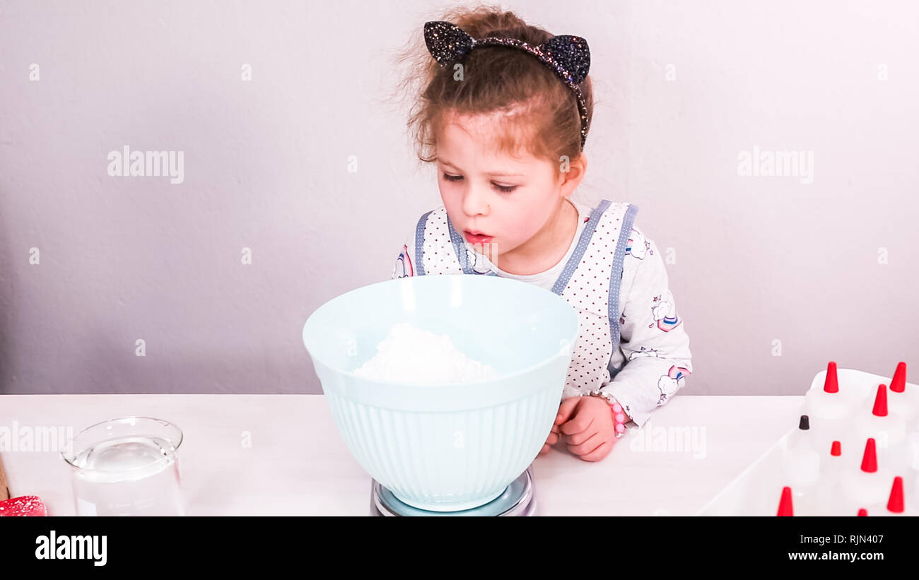 Step by step. Mixing royal icing to decorate sugar cookies Stock Photo ...