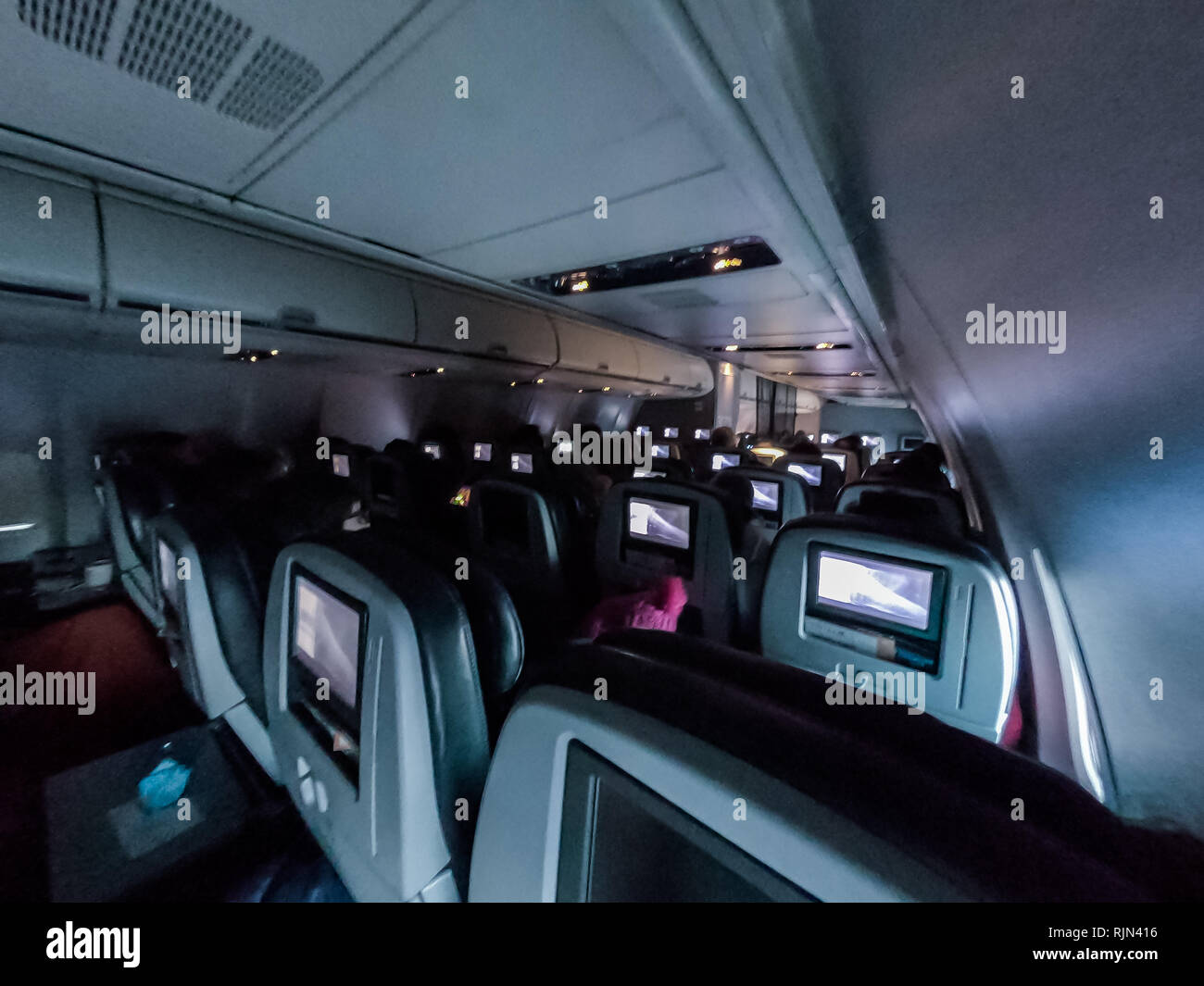 Economy class seats in mid size passanger airplane Stock Photo - Alamy