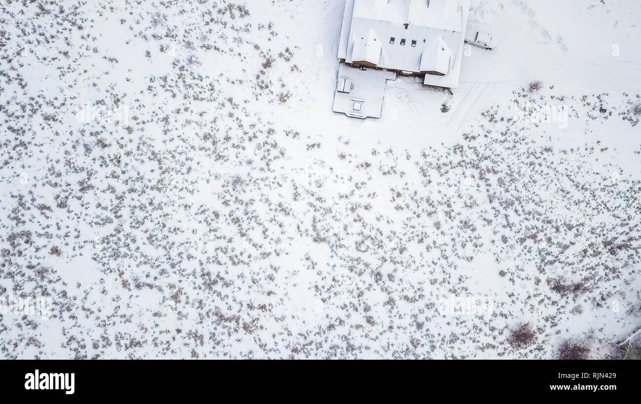 Aerial view of the mountain house covered in snow in the Winter Stock ...