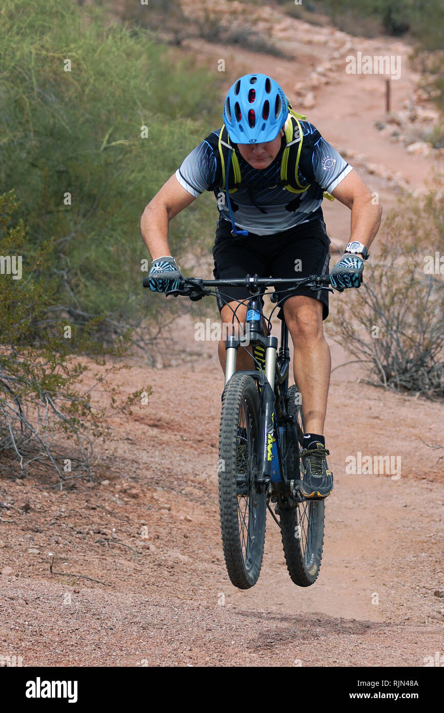 A mountain biker goes for a ride on a trail in Phoenix, Arizona Stock ...