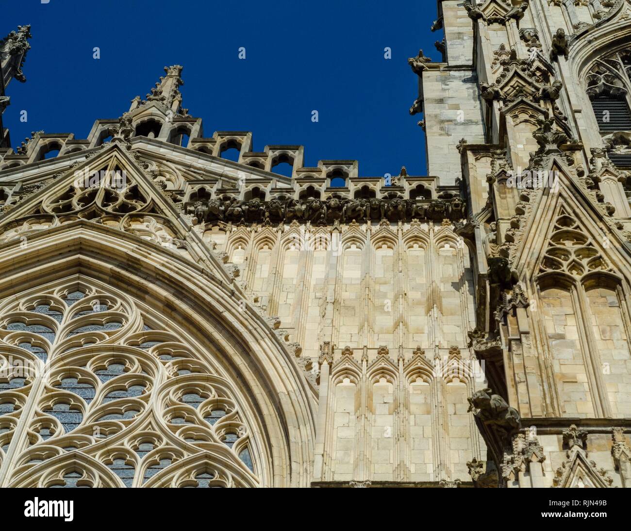 An image showing the Gothic details of the front wall and roofline of ...