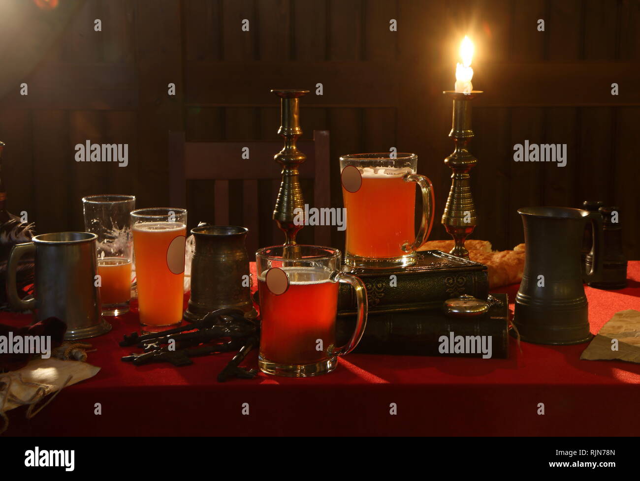 Still life with beer in old iron mugs Stock Photo - Alamy