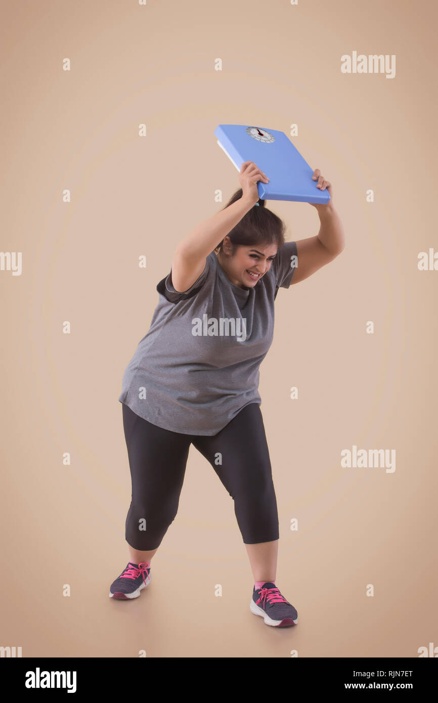 Woman and weight and frustrated hi-res stock photography and images - Alamy