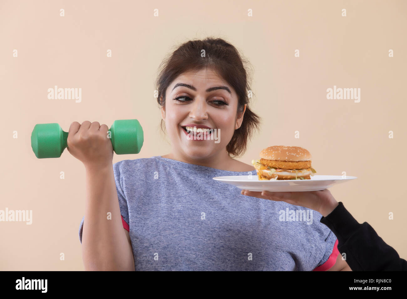 Excited Overweight Woman Exercising Cropped Hand Giving Burger Stock ...