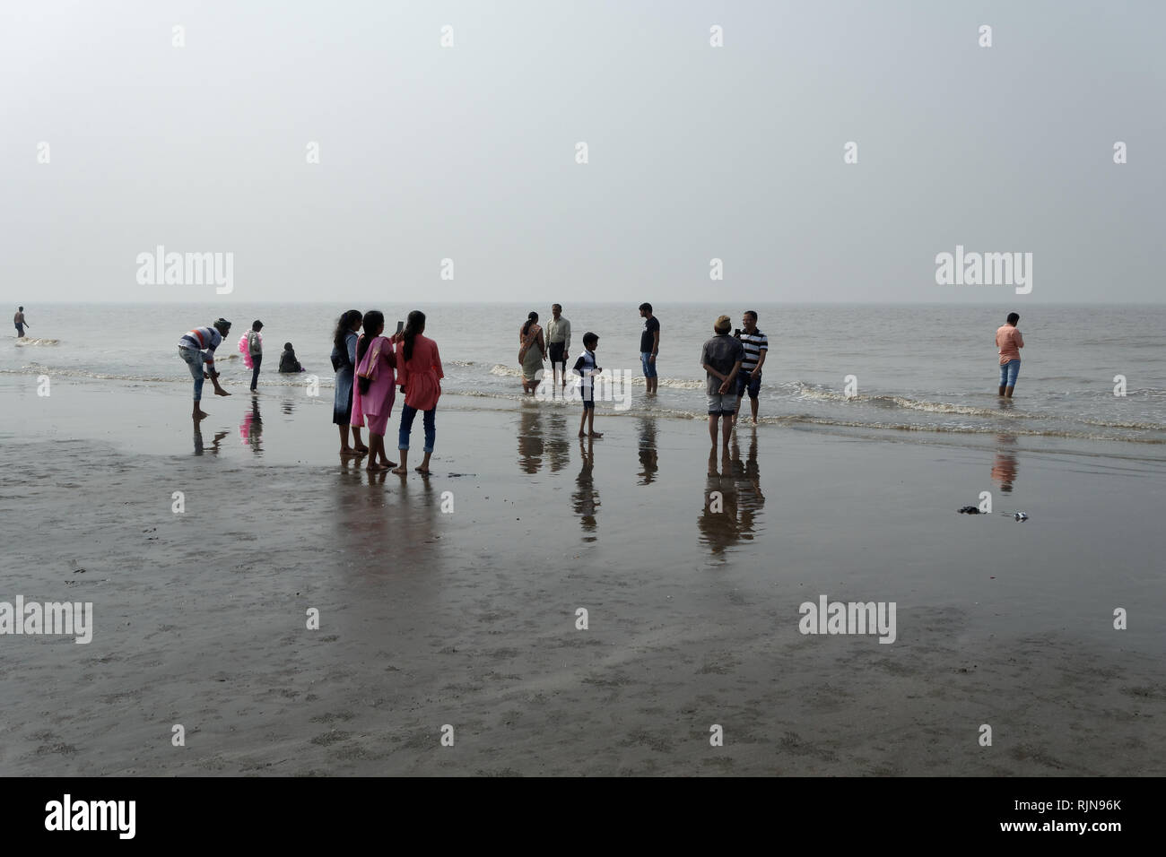 People enjoy strolling on Dandi Beach, near Navsari, Gujarat India ...
