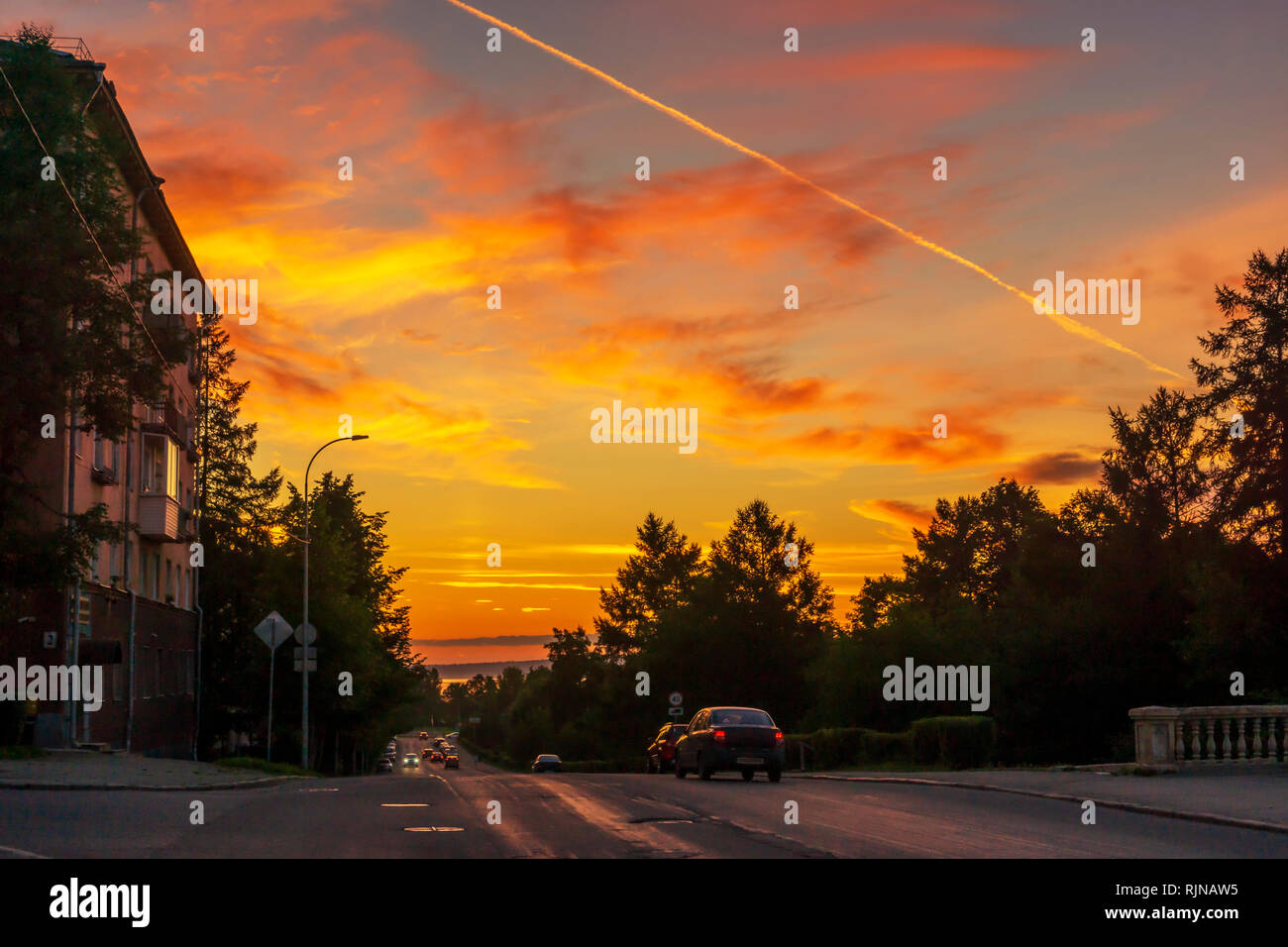 City street in downtown at sunset Stock Photo - Alamy