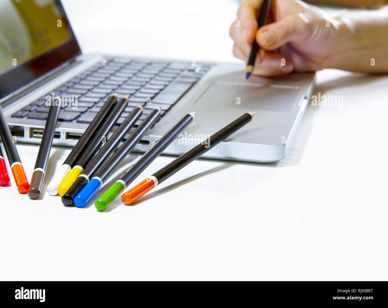 Digital or traditional graphic arts? A woman's hand seems to draw on ...