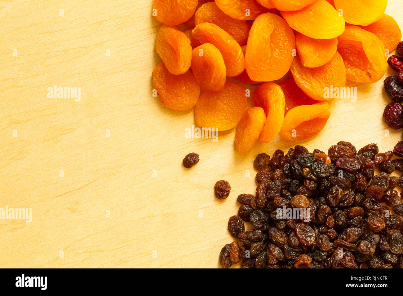 Healthy food organic nutrition. Border frame of dried fruits raisin and ...