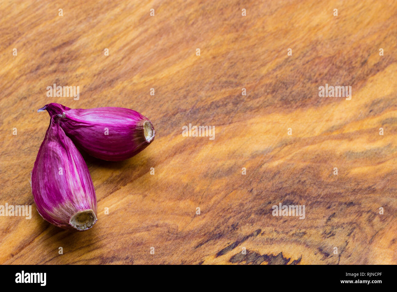 Healthy food. Organic garlic cloves on rustic wooden table background ...