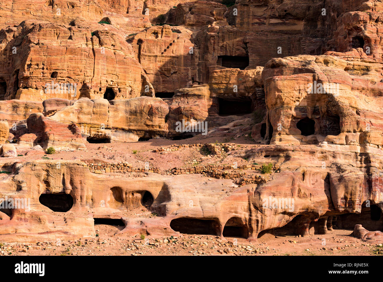 Amazing view of a rock formation with excavated caves in Petra Stock ...