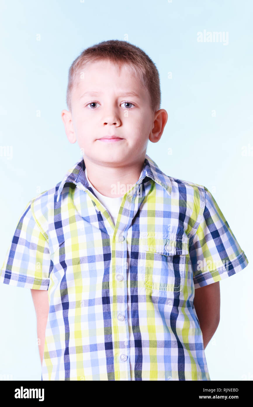 Independence and emotions. Shy little boy express self conscious hold ...