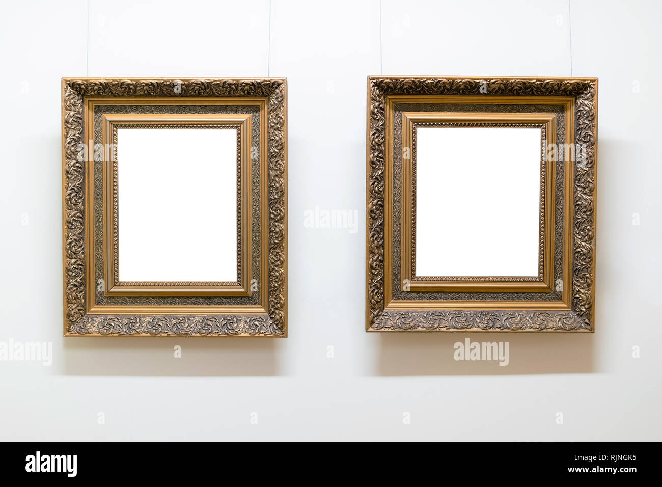 Blank empty frames hanging on museum wall. Art gallery, museum ...