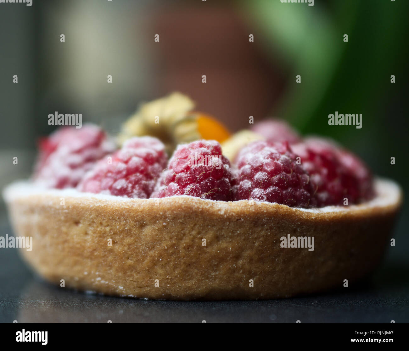 Raspberry berries in a cup-shaped cookies. Raspberry dessert Stock ...