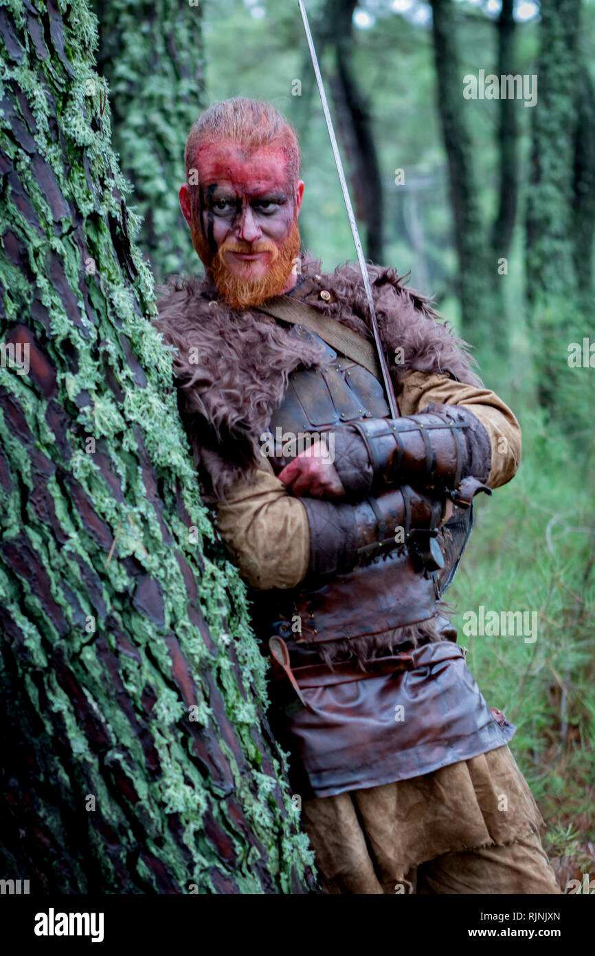 Real viking in the countryside with many trees around Stock Photo - Alamy