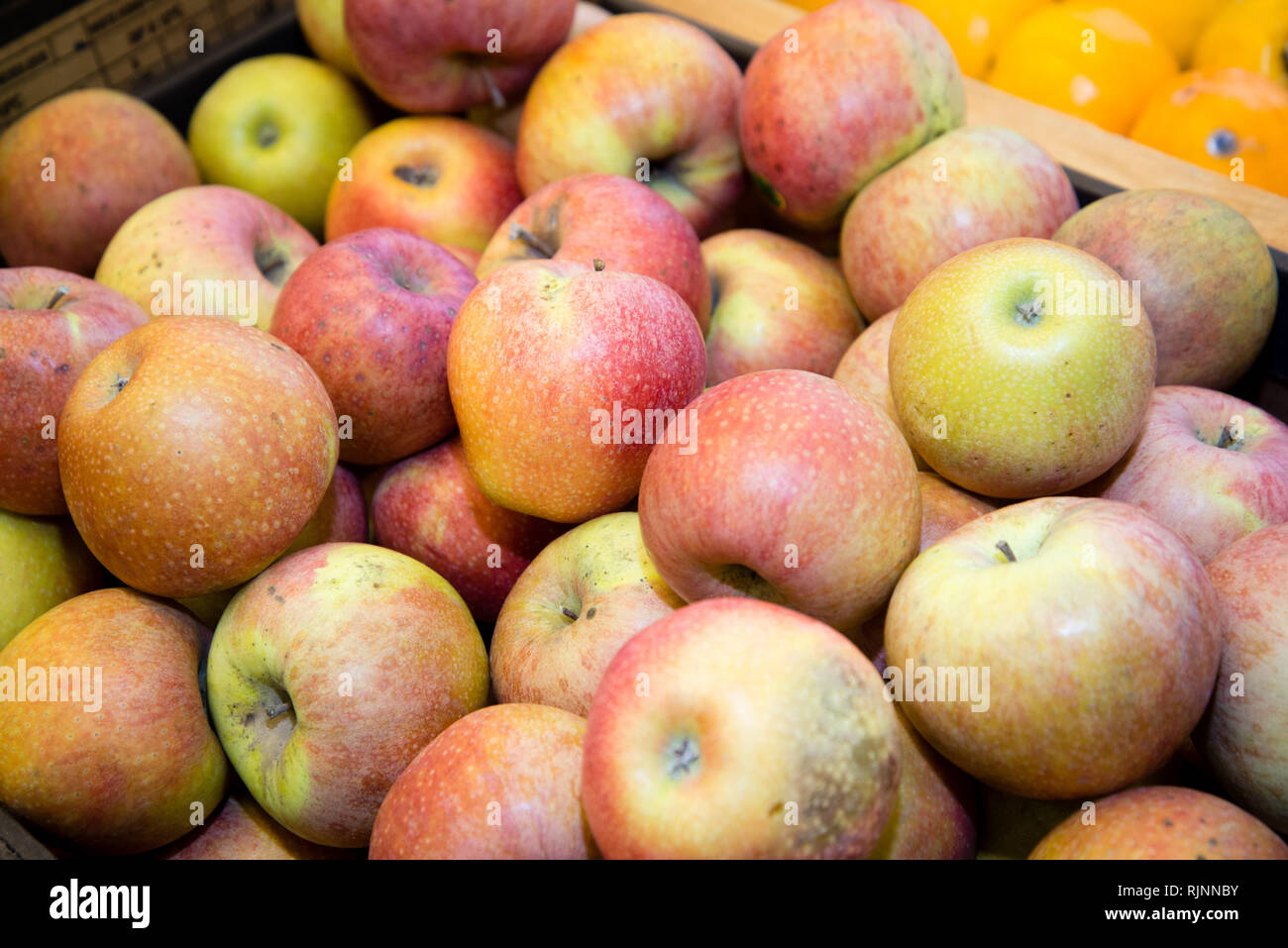 fresh fruit, ripe red apples on the counter in the supermarket Stock ...