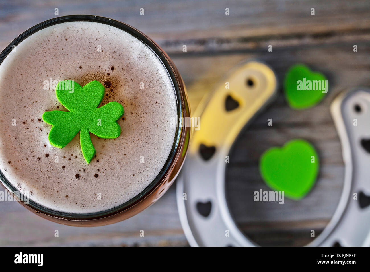St Patrick's day beer with green shamrock Stock Photo - Alamy