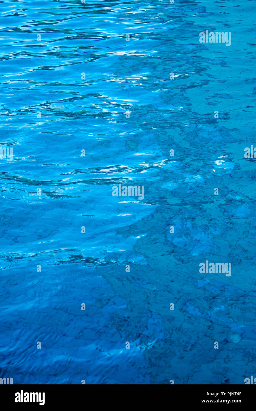 Reflection of sky on the moving water surface in the pool Stock Photo ...