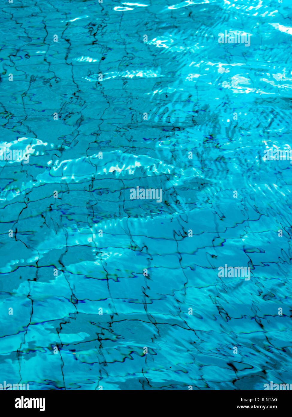 Reflection of sky on the moving water surface in the pool Stock Photo ...