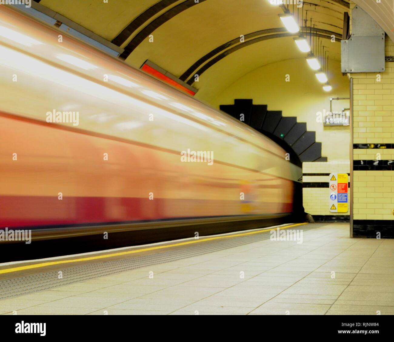 Train arriving at Northern Line platform of Warren Street Underground ...