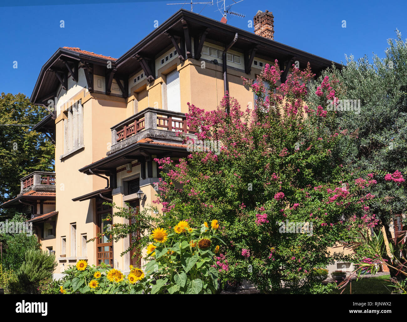beautiful country house in spring surrounded by flowering trees Stock ...