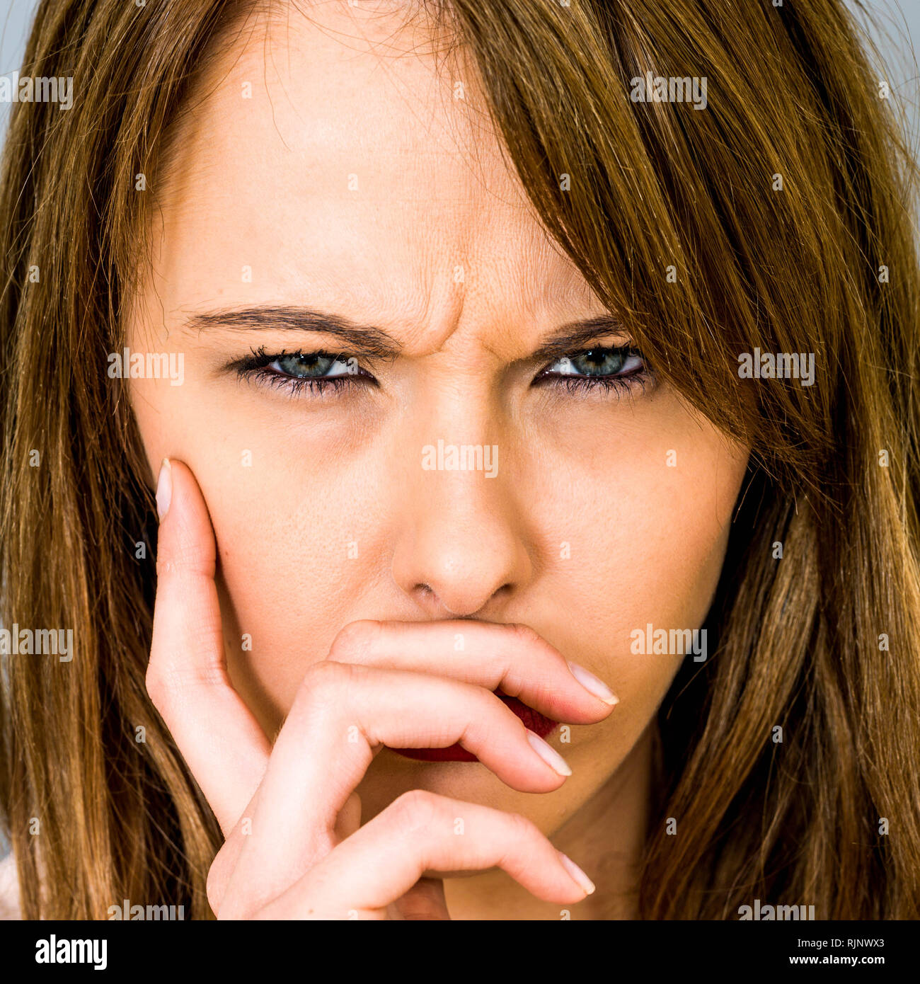 Thoughtful Worried Confused Woman Looking at the Camera Stock Photo - Alamy