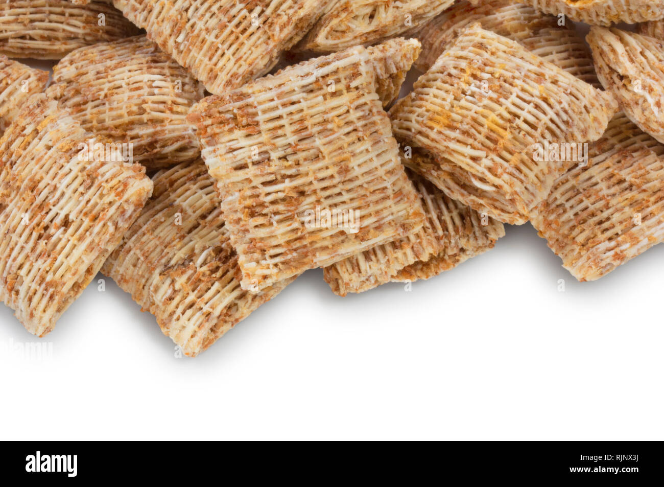 Studio shot of miniature bite size shredded wheat isolated against a ...