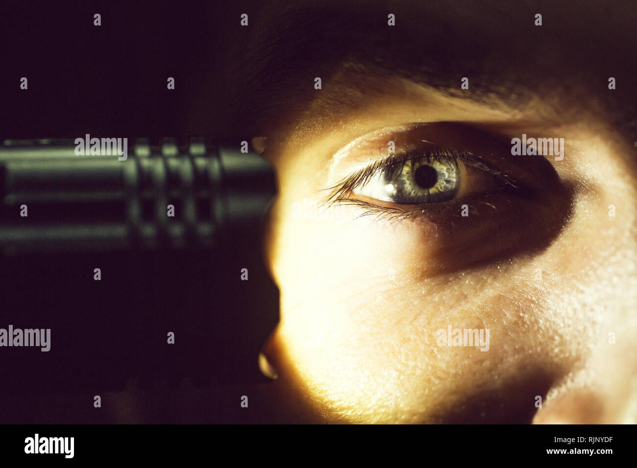 male eye with flashlight Stock Photo - Alamy