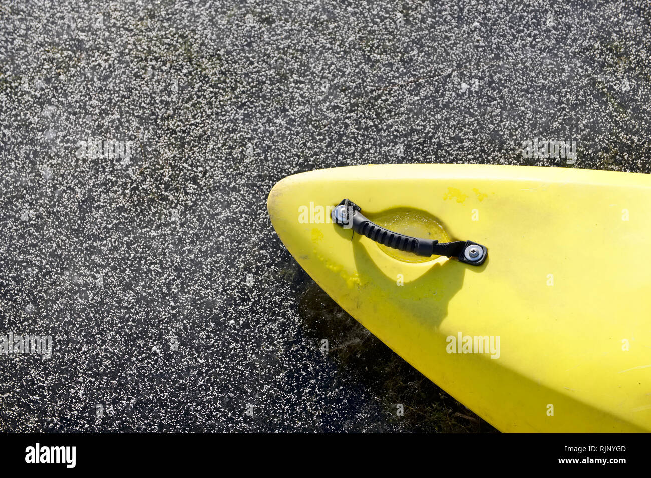 Canoe yellow on ice frozen water in winter ariel view from above Stock ...