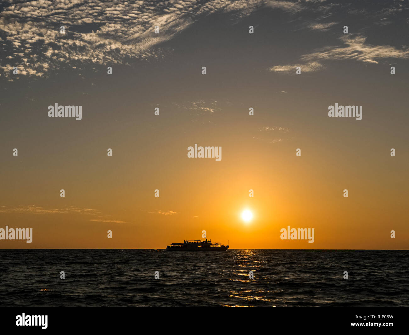 ship at sea against the sunset. Landscape ship in the ocean Stock Photo ...