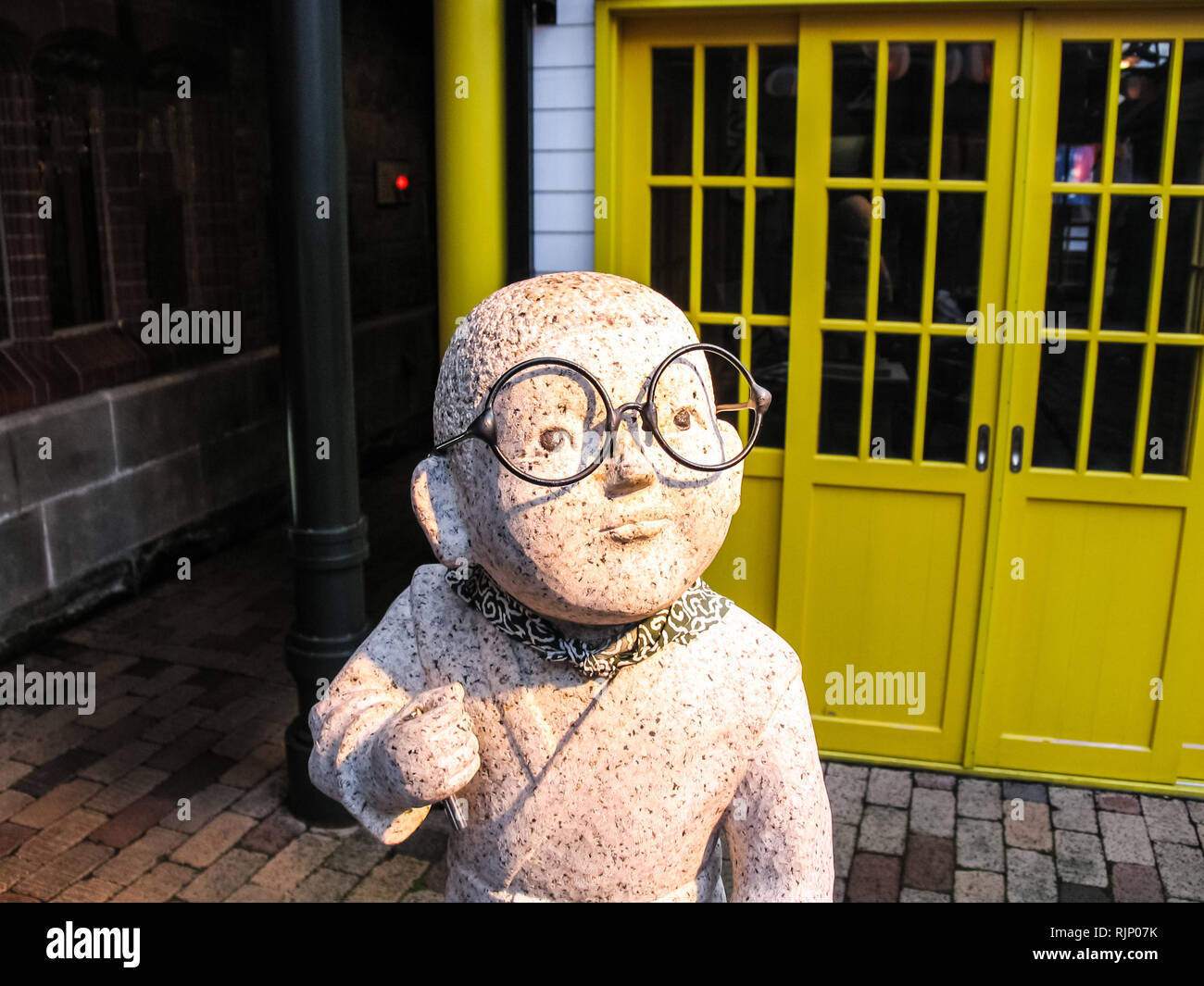 statue of a nerd boy with glasses. The statue of a child Stock Photo ...