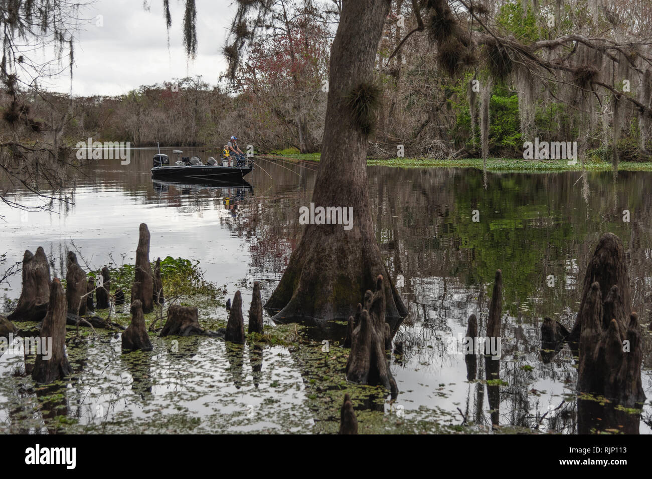 Man and young child fishing on the St.Johns River in Volusia County ...