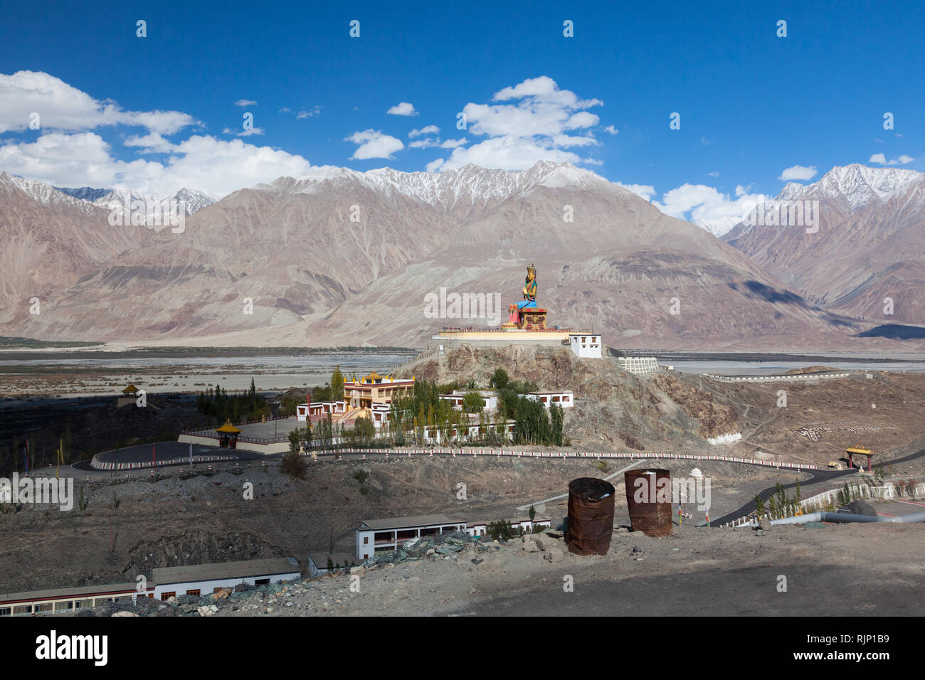 Landscape with statue of Jampa (Maitreya) Buddha seen from Diskit Gompa ...