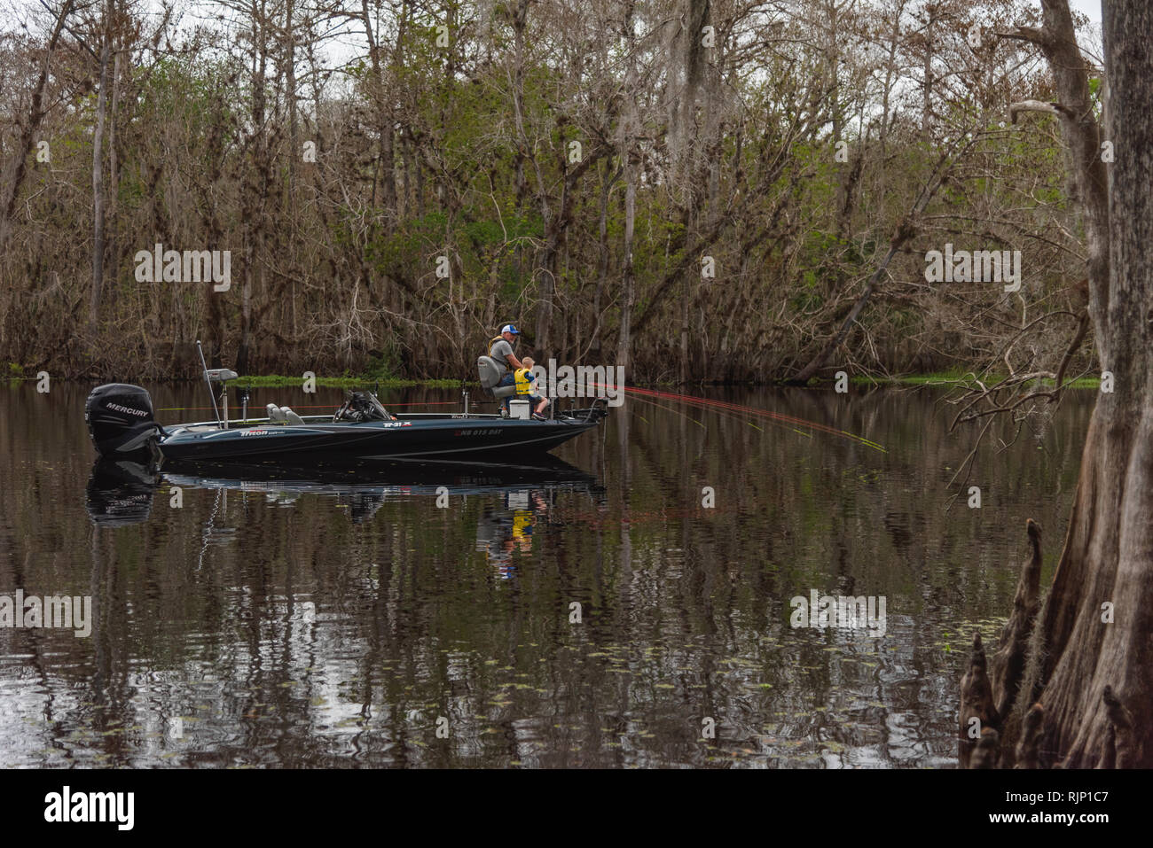 Man and young child fishing on the St.Johns River in Volusia County ...