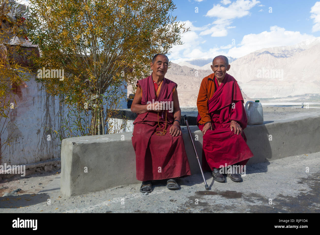 Two monks in Diskit Gompa (also known as Deskit Gompa), Nubra Valley ...
