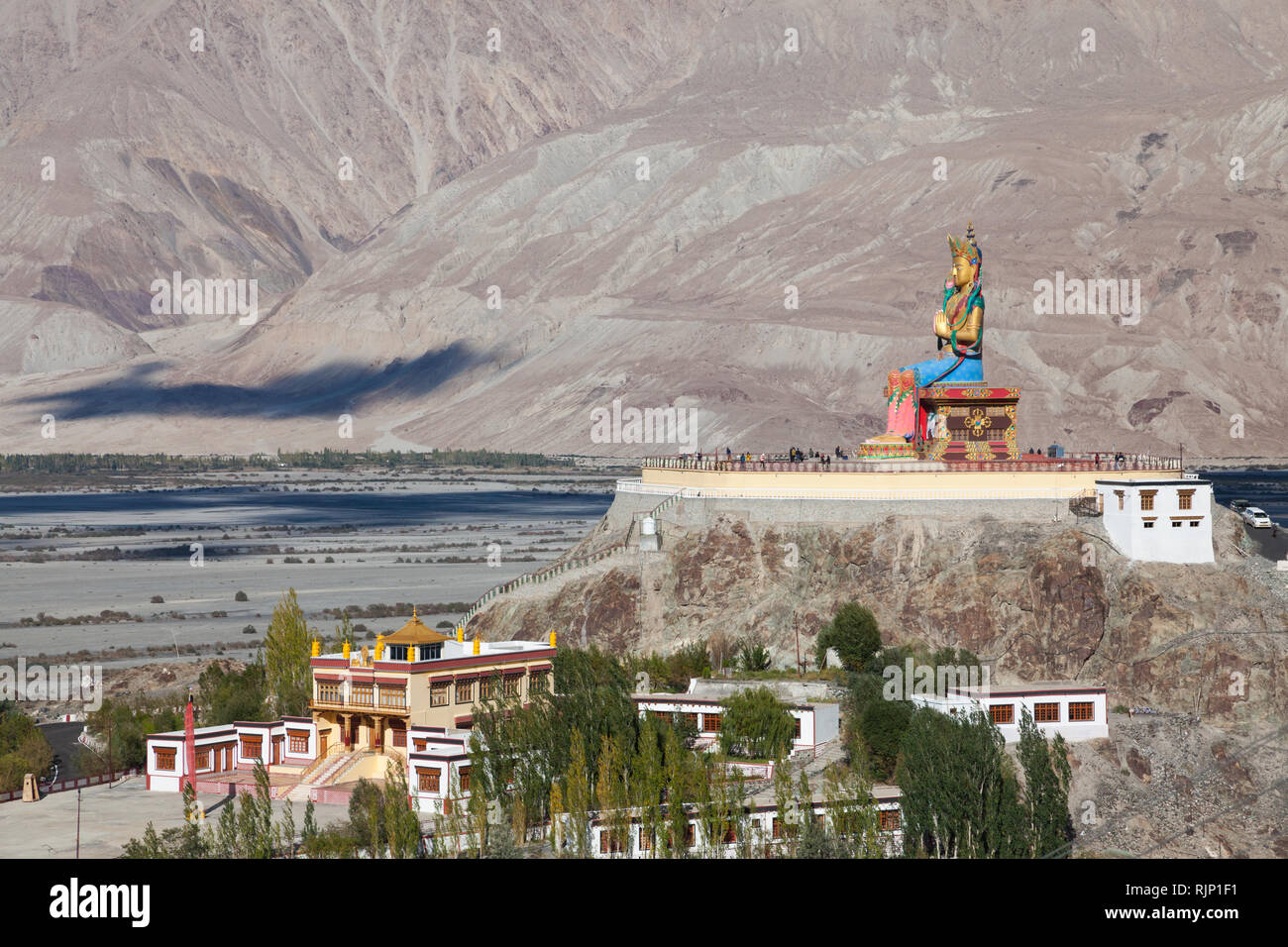 Landscape with statue of Jampa (Maitreya) Buddha seen from Diskit Gompa ...