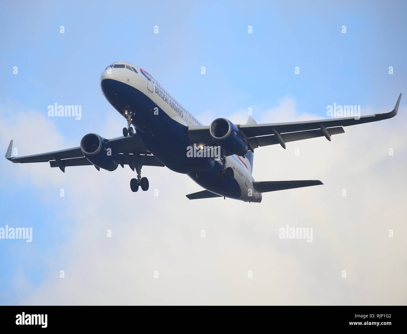 British Airways passenger jet aircraft with landing gear lowered Stock ...