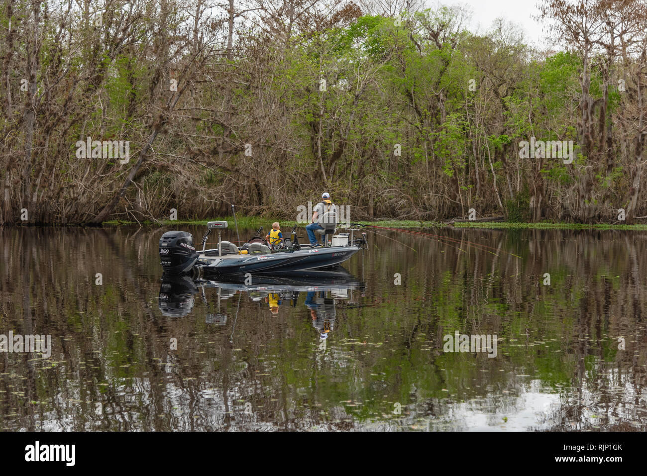 Man and young child fishing on the St.Johns River in Volusia County ...